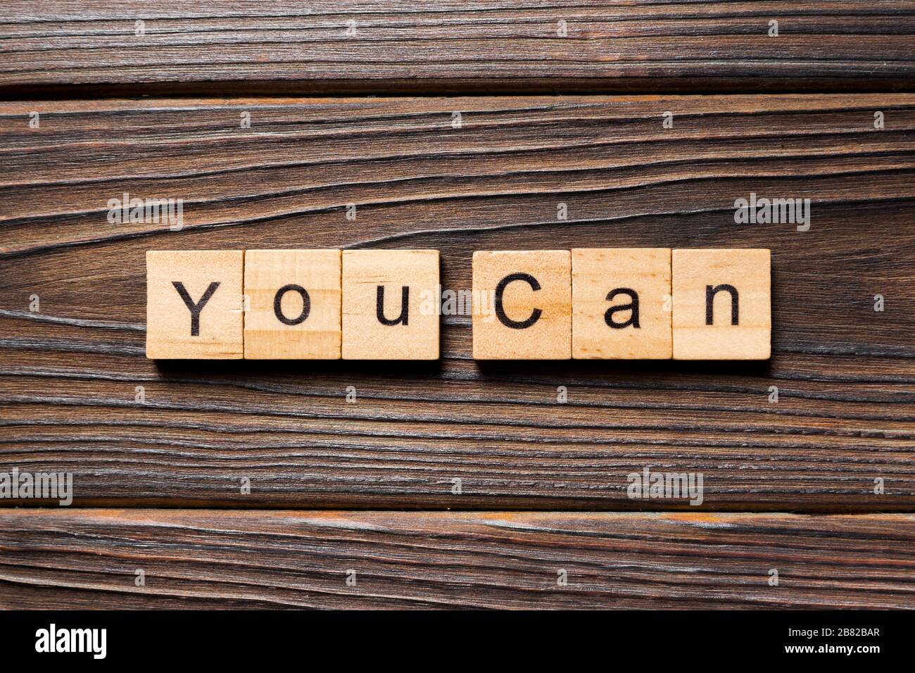 You can word written on wood block. You can text on wooden table for ...