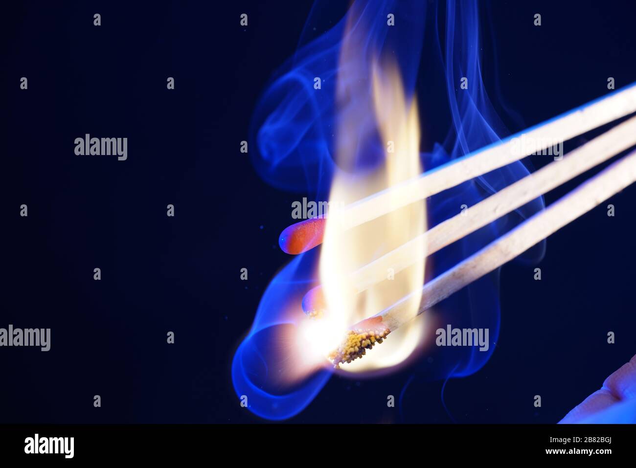 Lit matches and blown out in the studio photographed with colorful ...