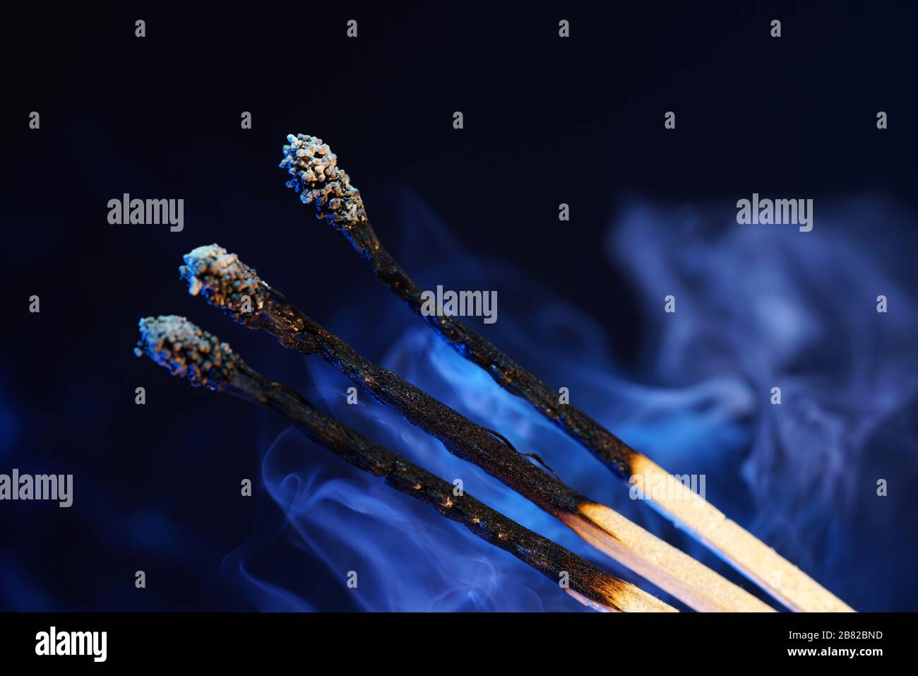Lit matches and blown out in the studio photographed with colorful ...