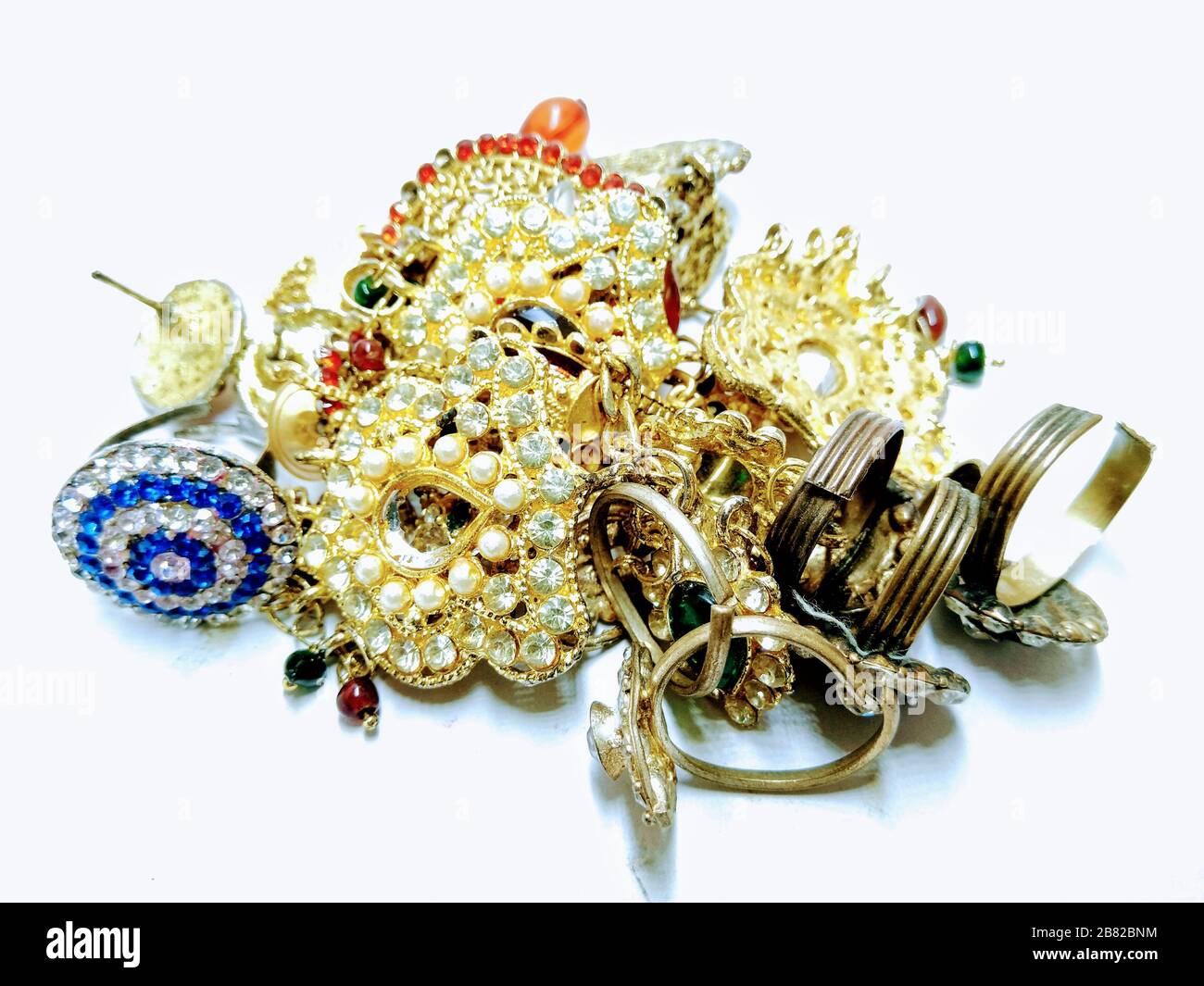 Golden round earring hi-res stock photography and images - Alamy