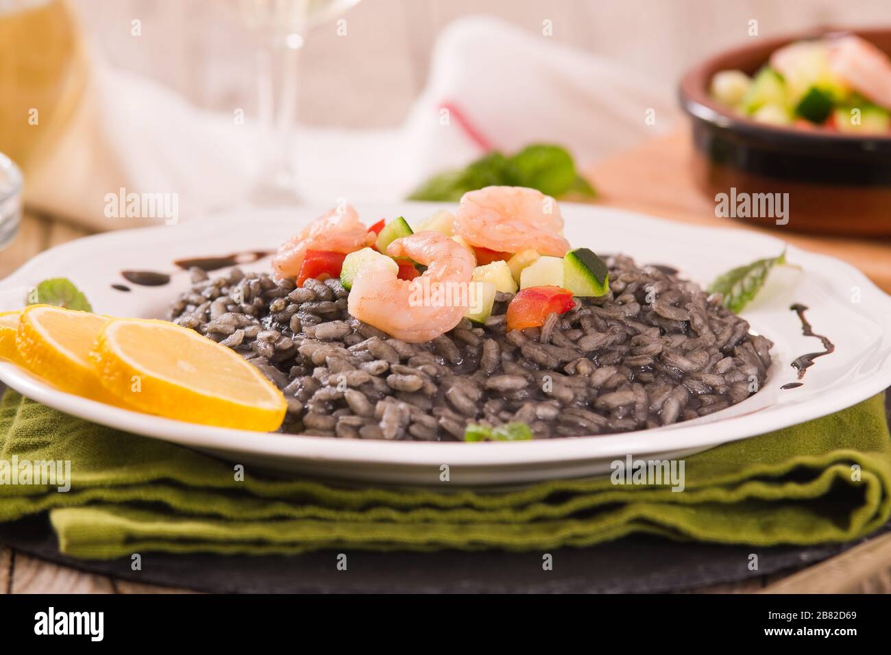 Squid ink risotto Stock Photo - Alamy