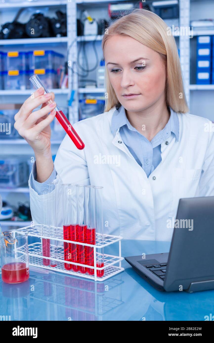Girl laboratory Assistant works with an antiviral drug in a ...