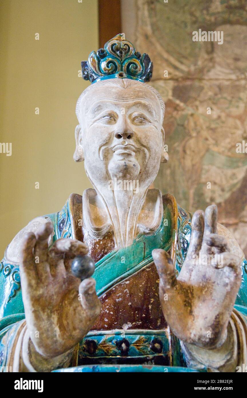 A stoneware figure of a Daoist deity from the Ming Dynasty at the ...