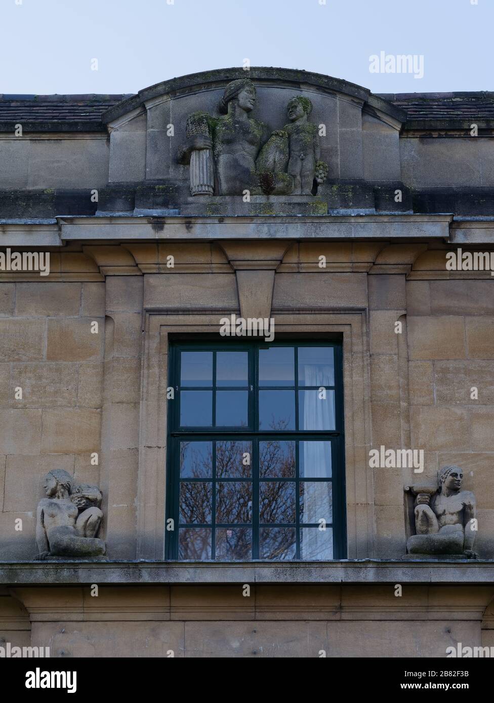 Detail of the facade of the Eltham Palace with Art Deco sculptures and ...