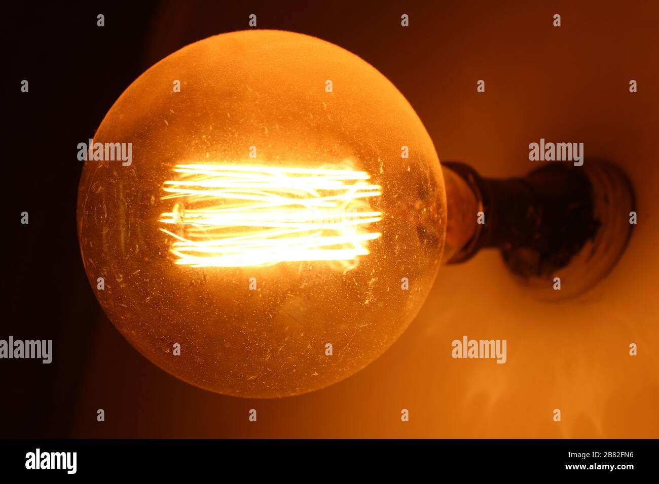 Light on the dark, big bulb Stock Photo - Alamy