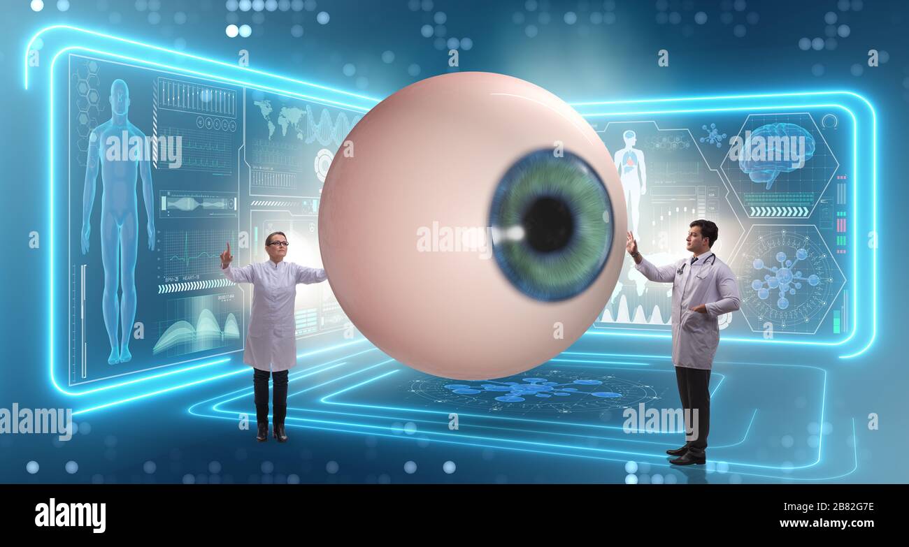 The doctor examining giant eye in medical concept Stock Photo - Alamy
