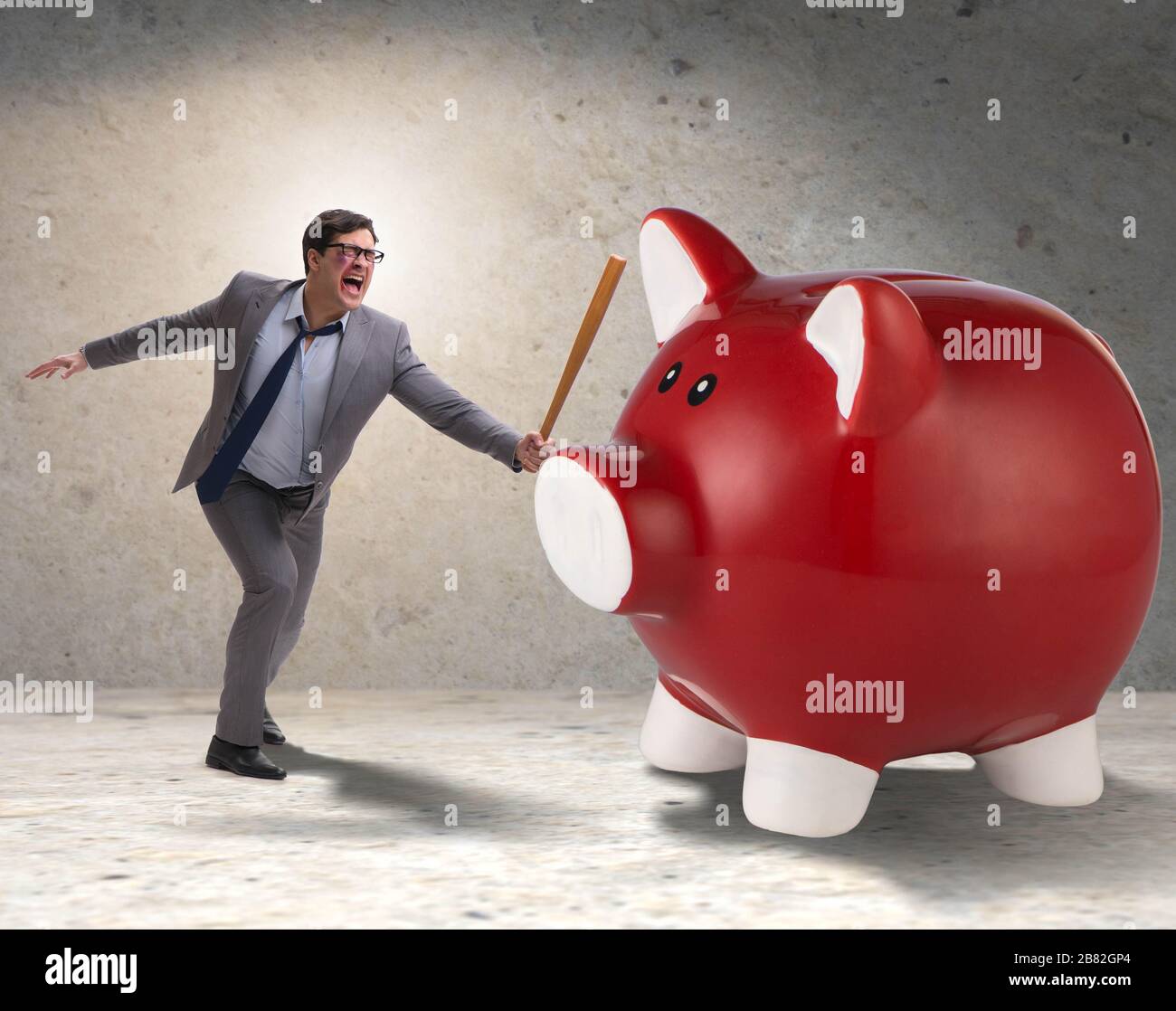 The angry man with baseball bat hitting piggybank Stock Photo - Alamy