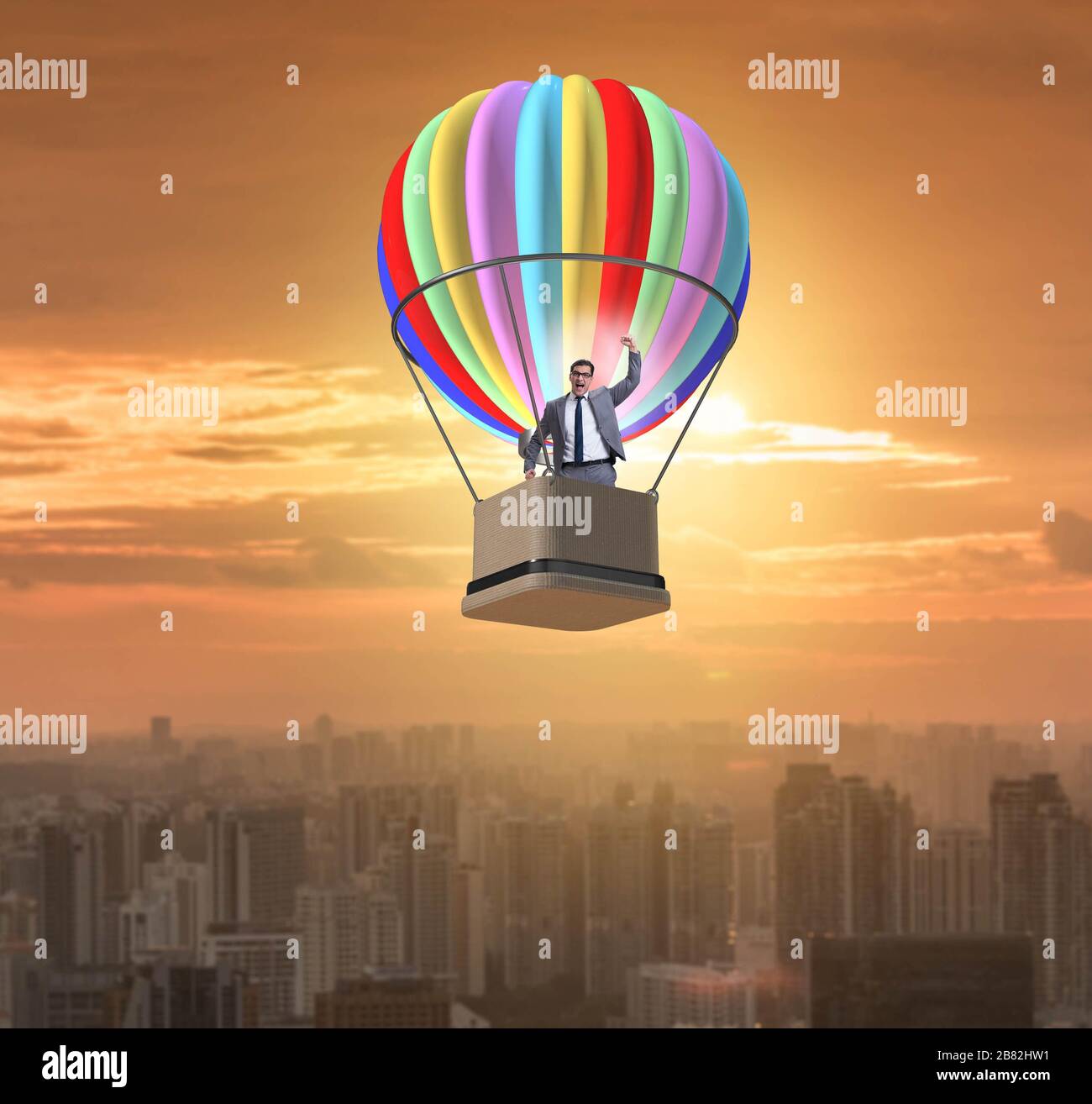 The businessman flying on balloon in challenge concept Stock Photo - Alamy