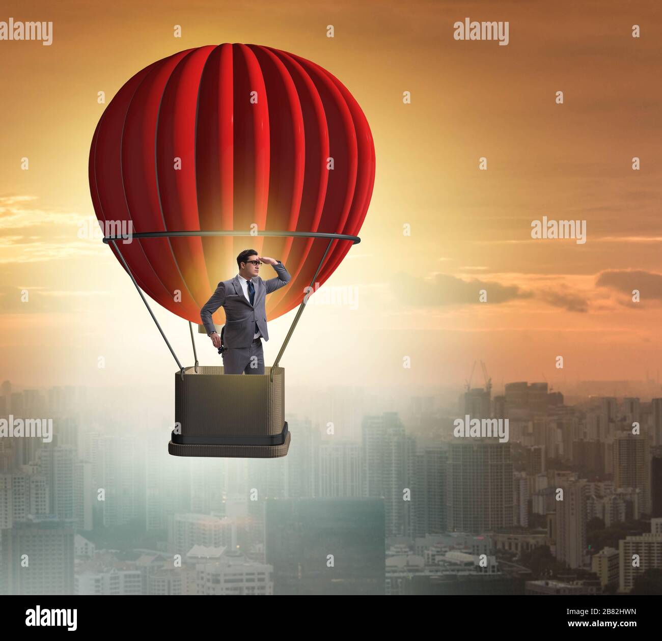 The businessman flying on balloon in challenge concept Stock Photo - Alamy