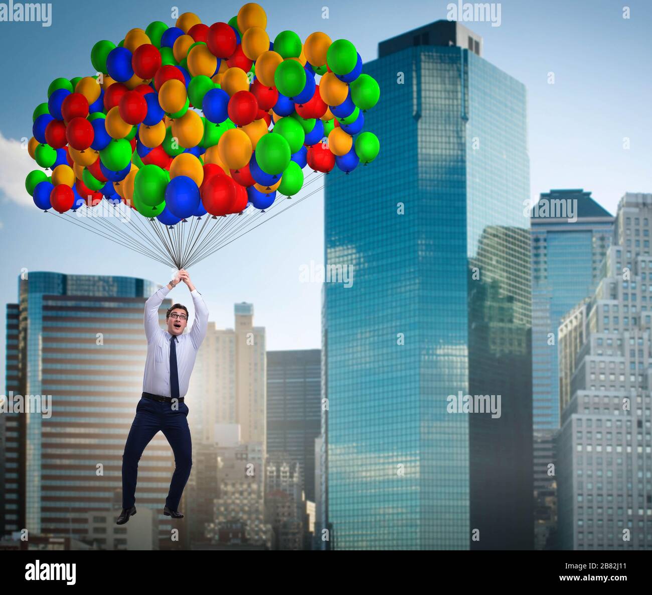 The businessman flying on balloons in challenge concept Stock Photo - Alamy
