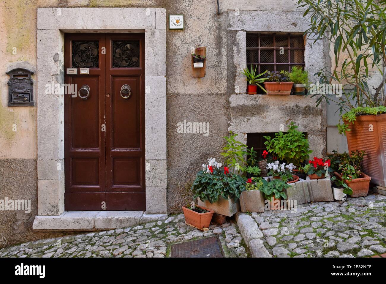 The entrance to an old house in Veroli, a medieval village in central ...