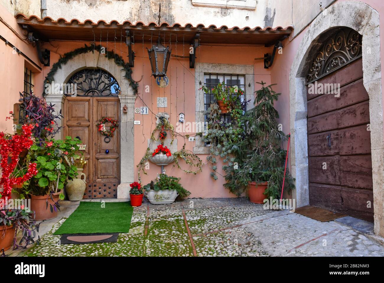 The entrance to an old house in Veroli, a medieval village in central ...