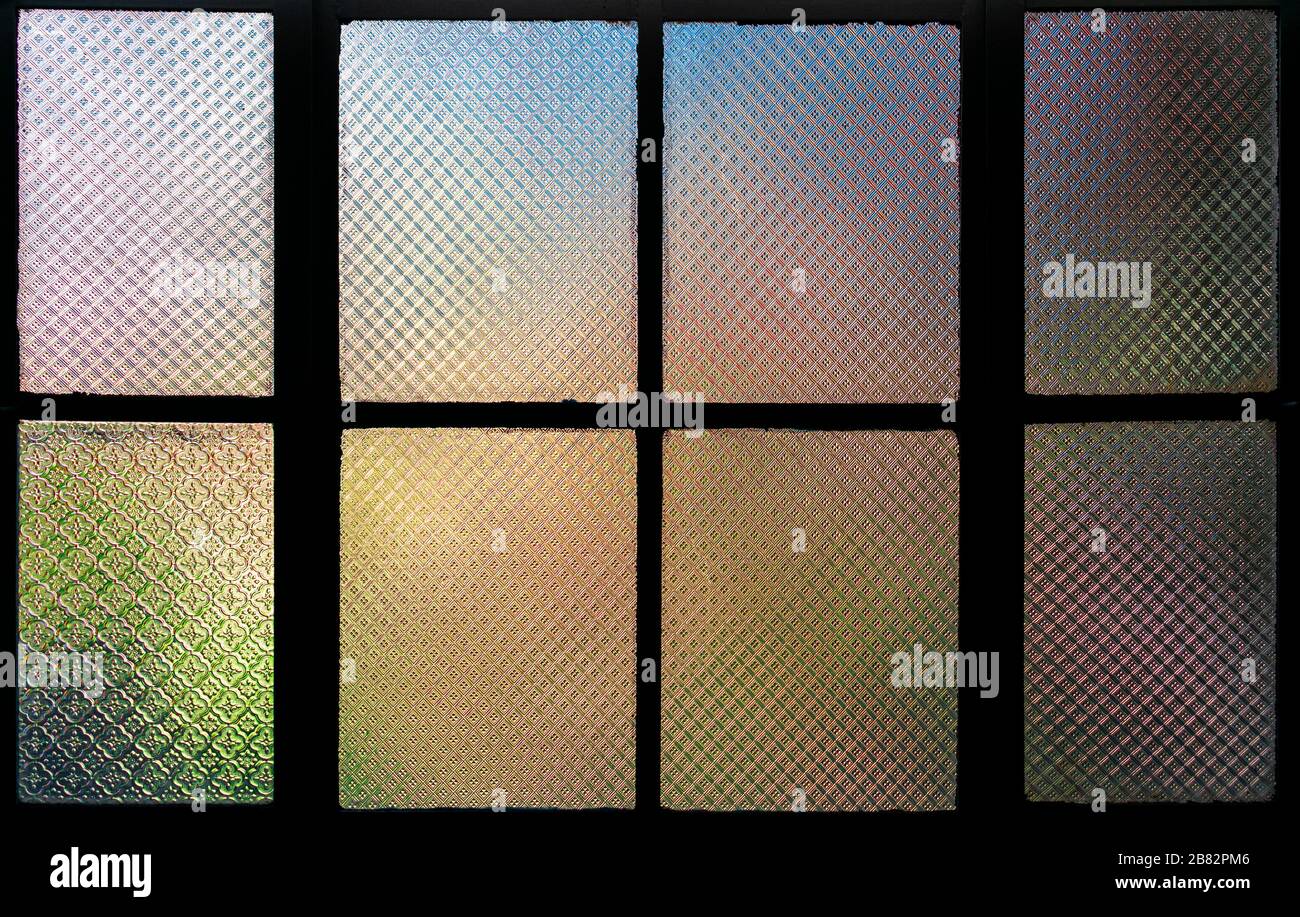 Symmetrical and colorful backlit window Stock Photo - Alamy