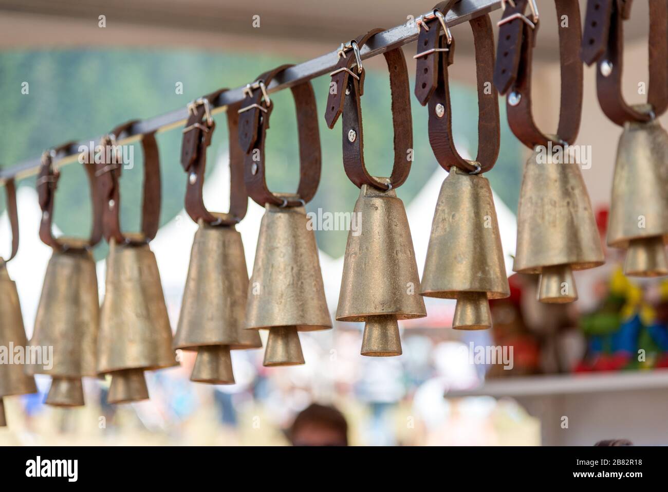 Hanging cow/sheep bell with a leather strap Stock Photo - Alamy