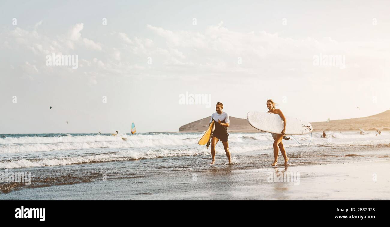 Man running into waves hi-res stock photography and images - Alamy