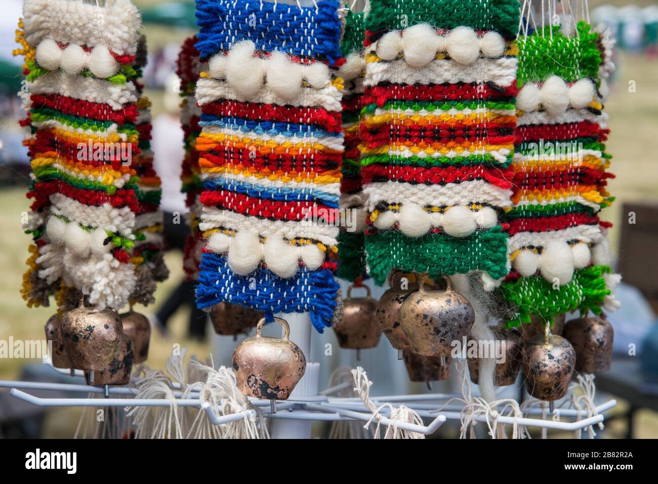 Hanging cow/sheep bell with a woven strap Stock Photo - Alamy