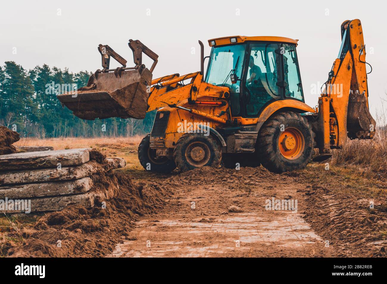 Excavator digging up pavement hi-res stock photography and images - Alamy