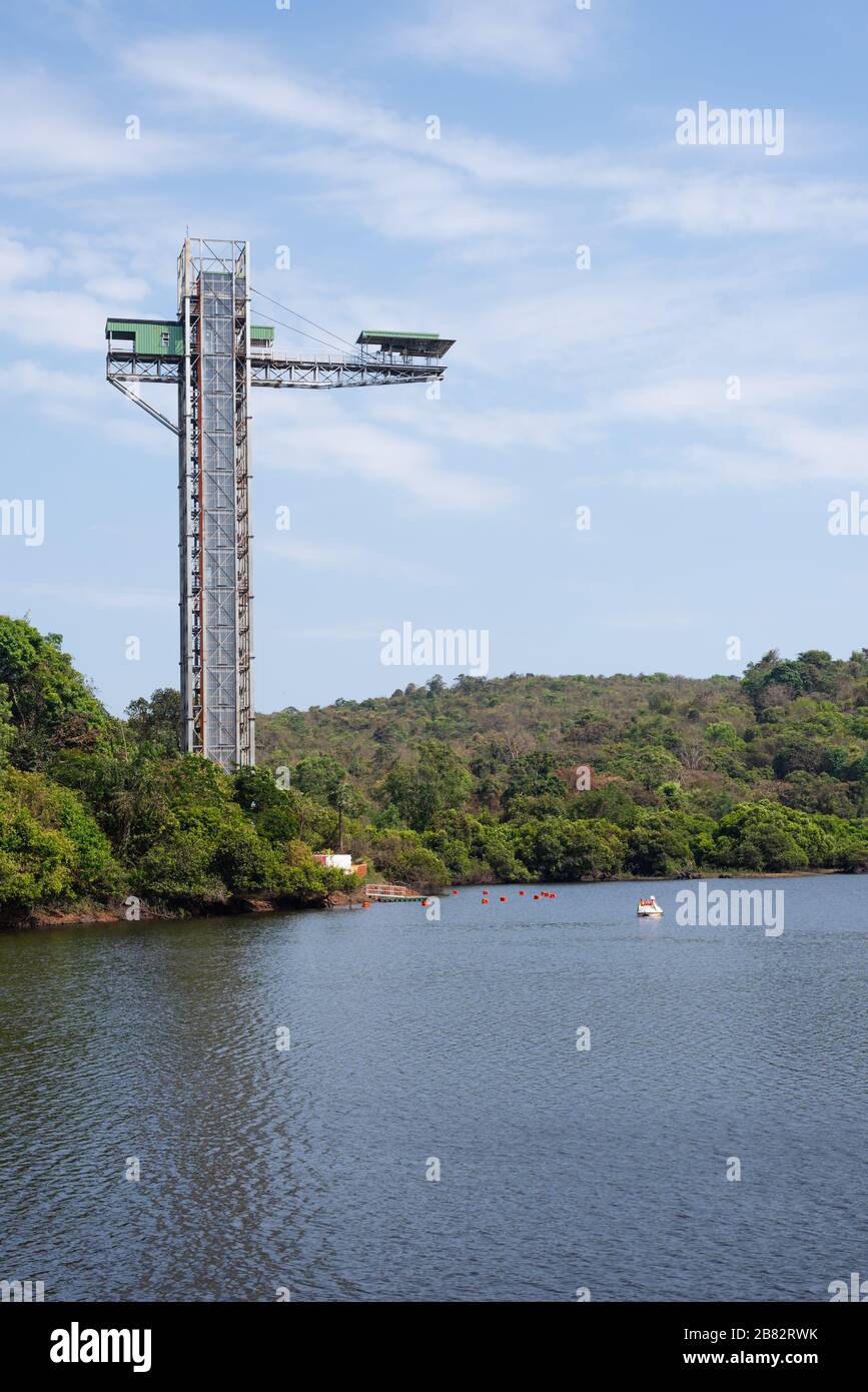Landscape image of Mayem Lake in Goa with the bungee jumping structure ...