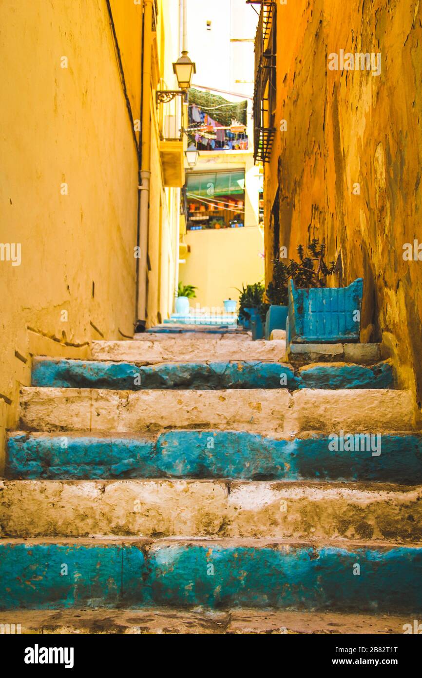 Yellow Walls and Teal Blue Green Stairs on a Small Passage in Alicante ...