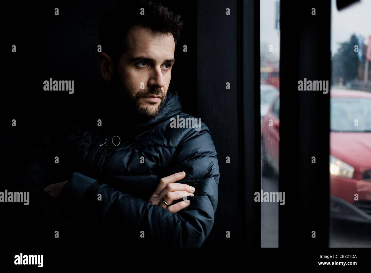 Young male commuter riding in public transport Stock Photo - Alamy