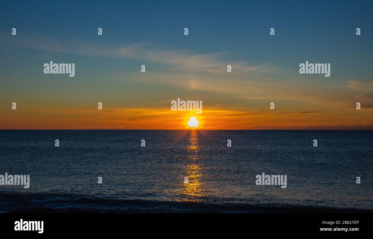 Floating on calm beach sunset hi-res stock photography and images - Alamy