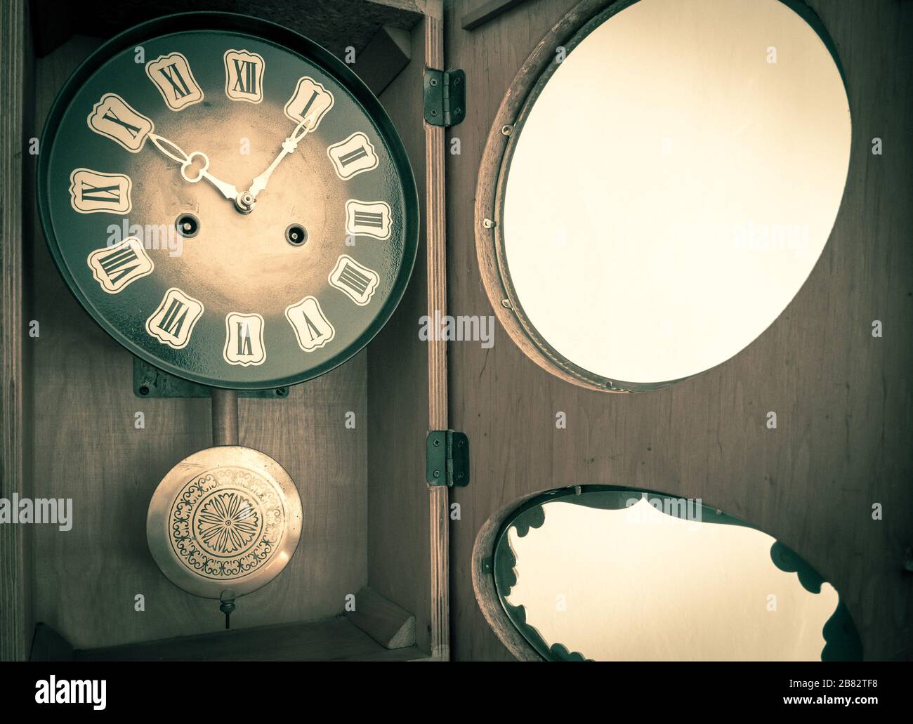 Old vintage wall clock with pendulum. Vintage wall clock made in former ...