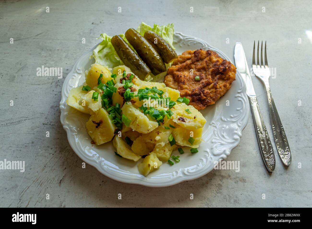 Cutlet with potatoes as the main dinner dish Stock Photo - Alamy