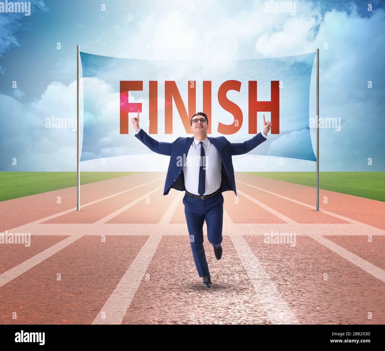 The businessman on the finishing line in competition concept Stock ...