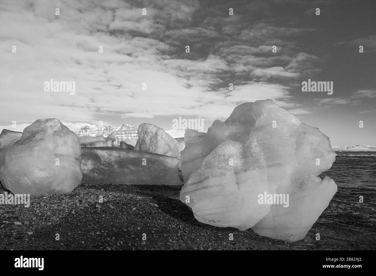 ice fields at the black pebble beach, coast of iceland Stock Photo - Alamy