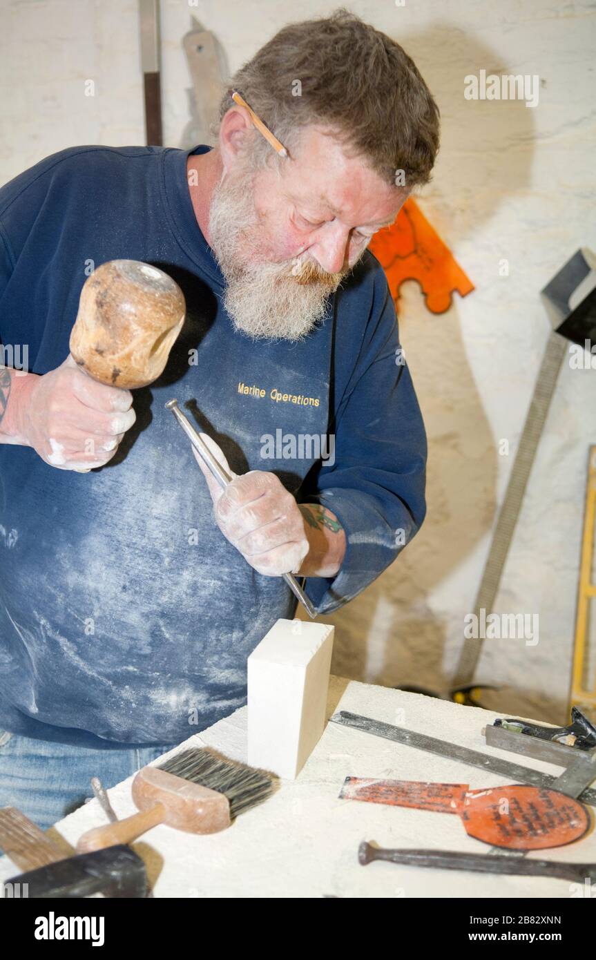 A stonemason working Stock Photo - Alamy