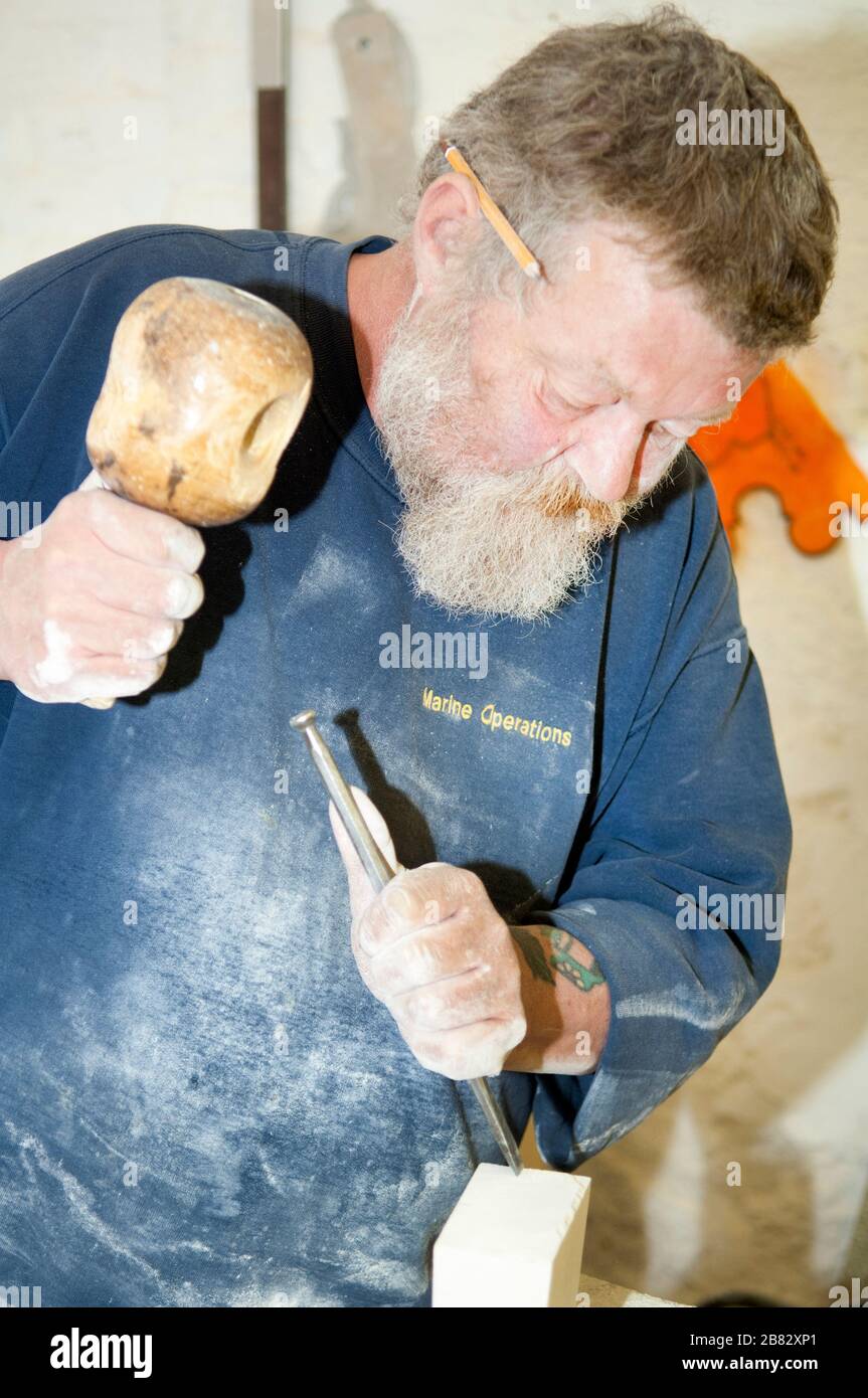 A stonemason working Stock Photo - Alamy
