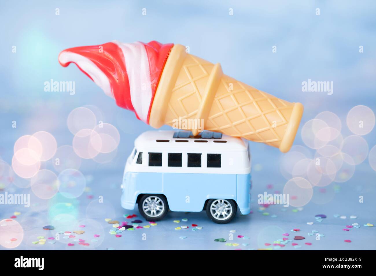 Little toy car with an ice cream cone and bokeh lights Stock Photo - Alamy