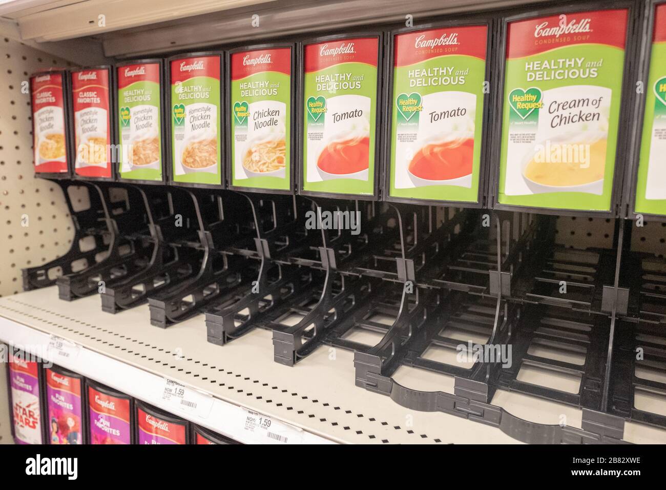 Empty shelves in a canned goods section are visible at a Target retail ...