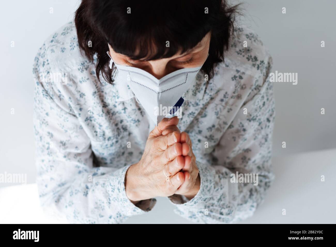 Coronavirus quarantine Covid-19 concept. Face of old sick woman wearing ...