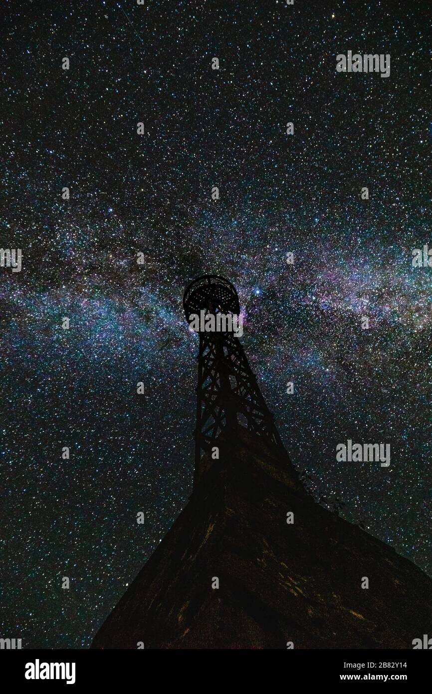 Starry night lighthouse. Milky way core visible Stock Photo - Alamy