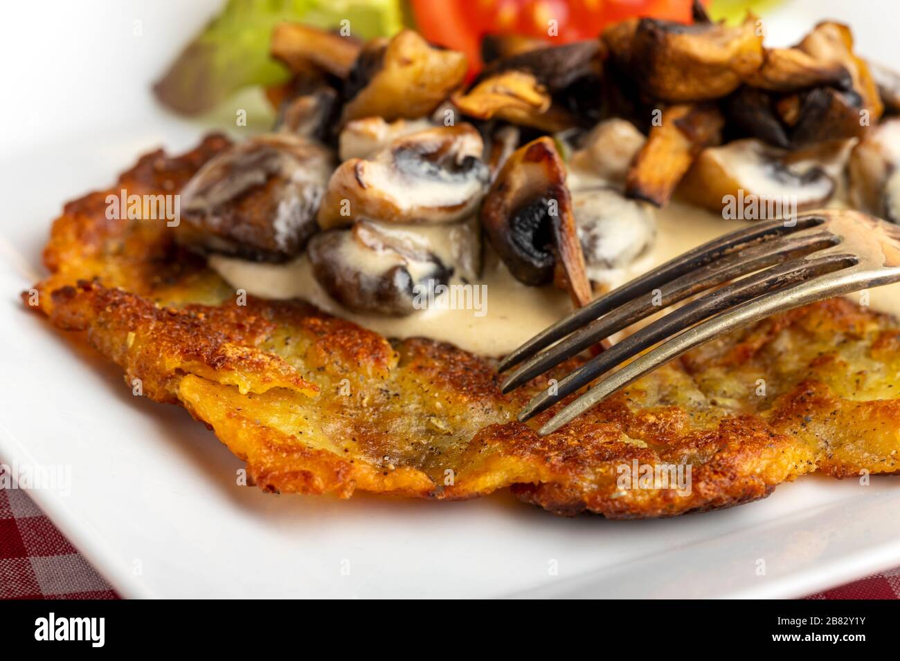 swiss roesti with mushroom sauce Stock Photo - Alamy