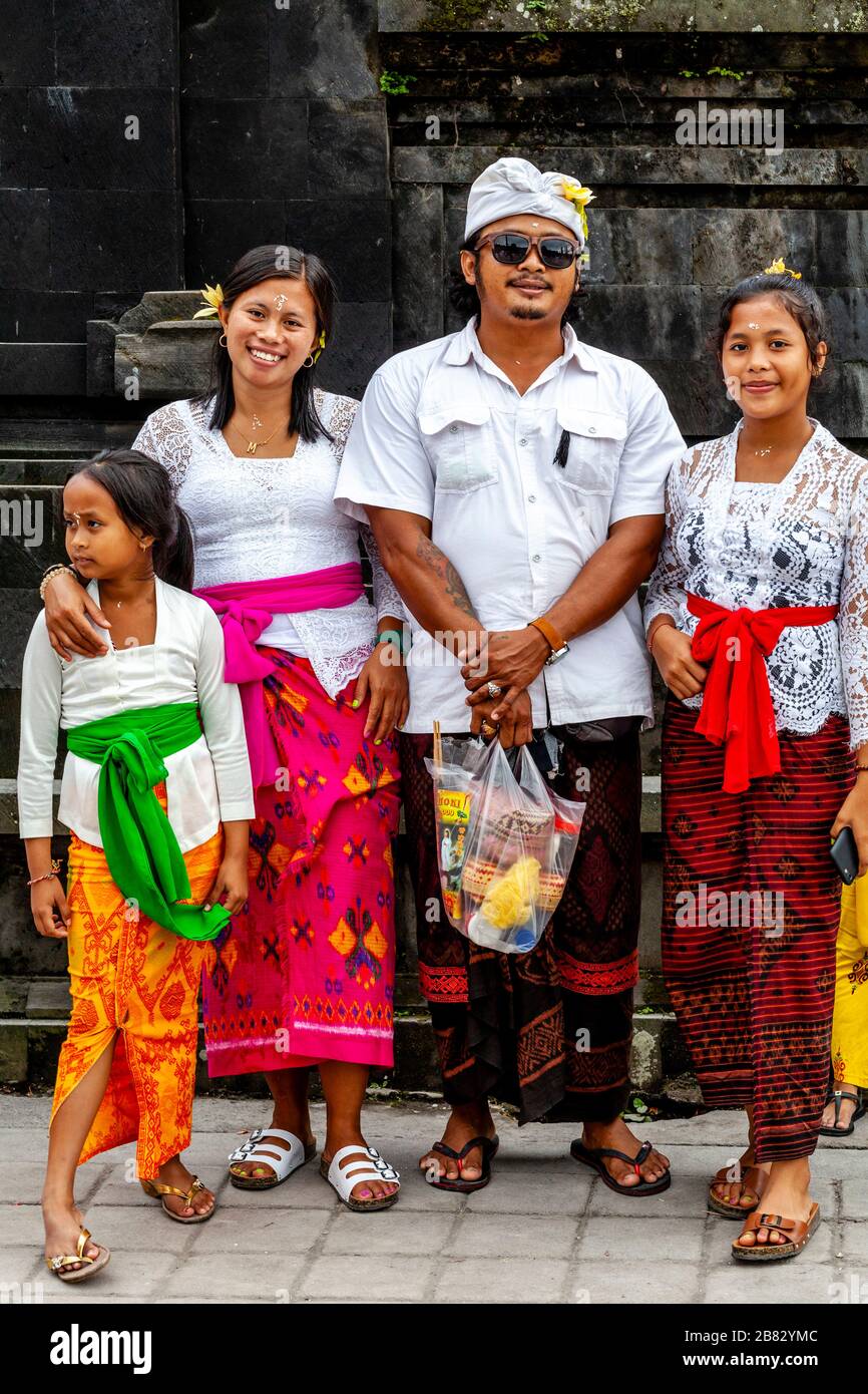 A Balinese Hindu Family Pose For Photos At The Batara Turun Kabeh ...