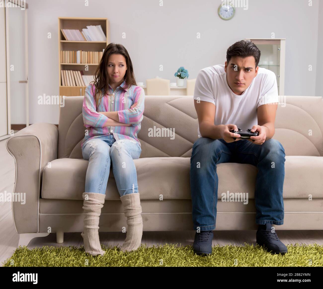 The young family suffering from computer games addiction Stock Photo ...