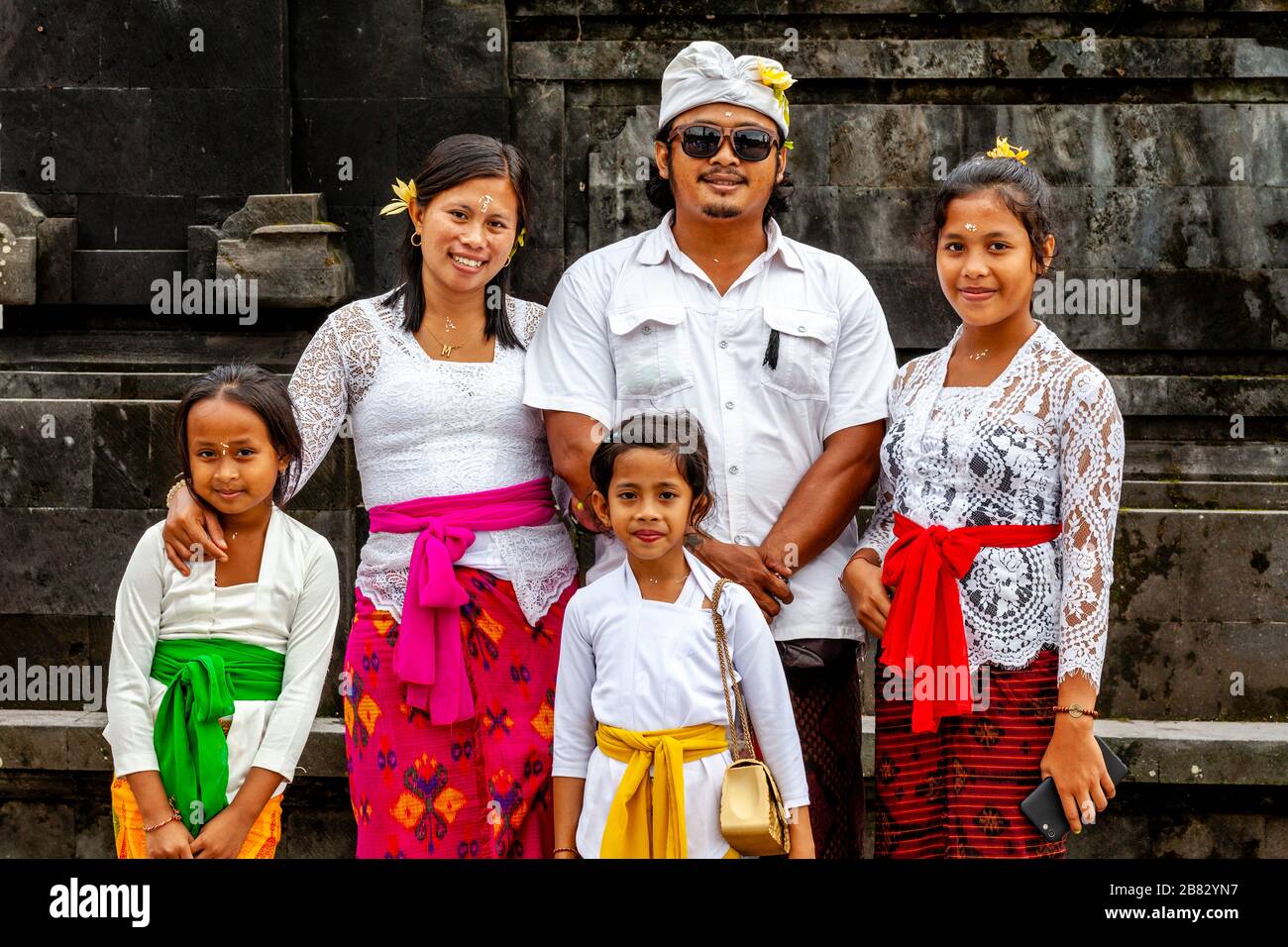 A Balinese Hindu Family Pose For Photos At The Batara Turun Kabeh ...