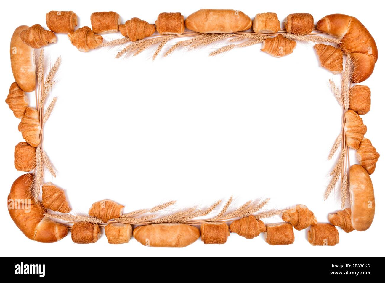 frame made of different kinds of bread, croissants, buns and wheat ...