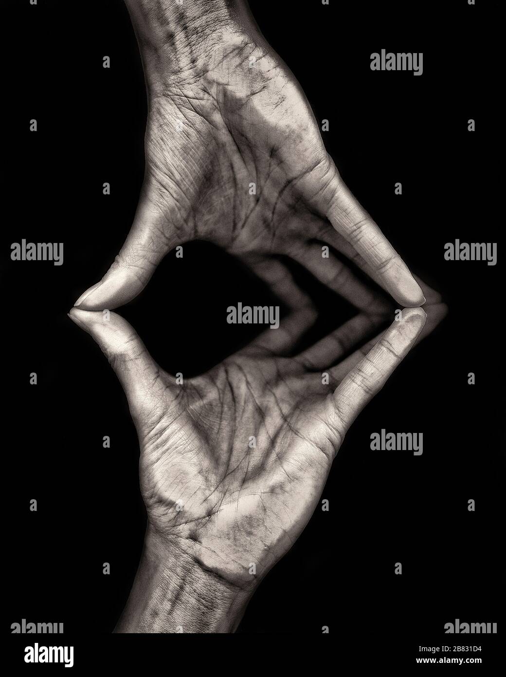 Two Hands with Touching Fingertips against Black Background Stock Photo ...