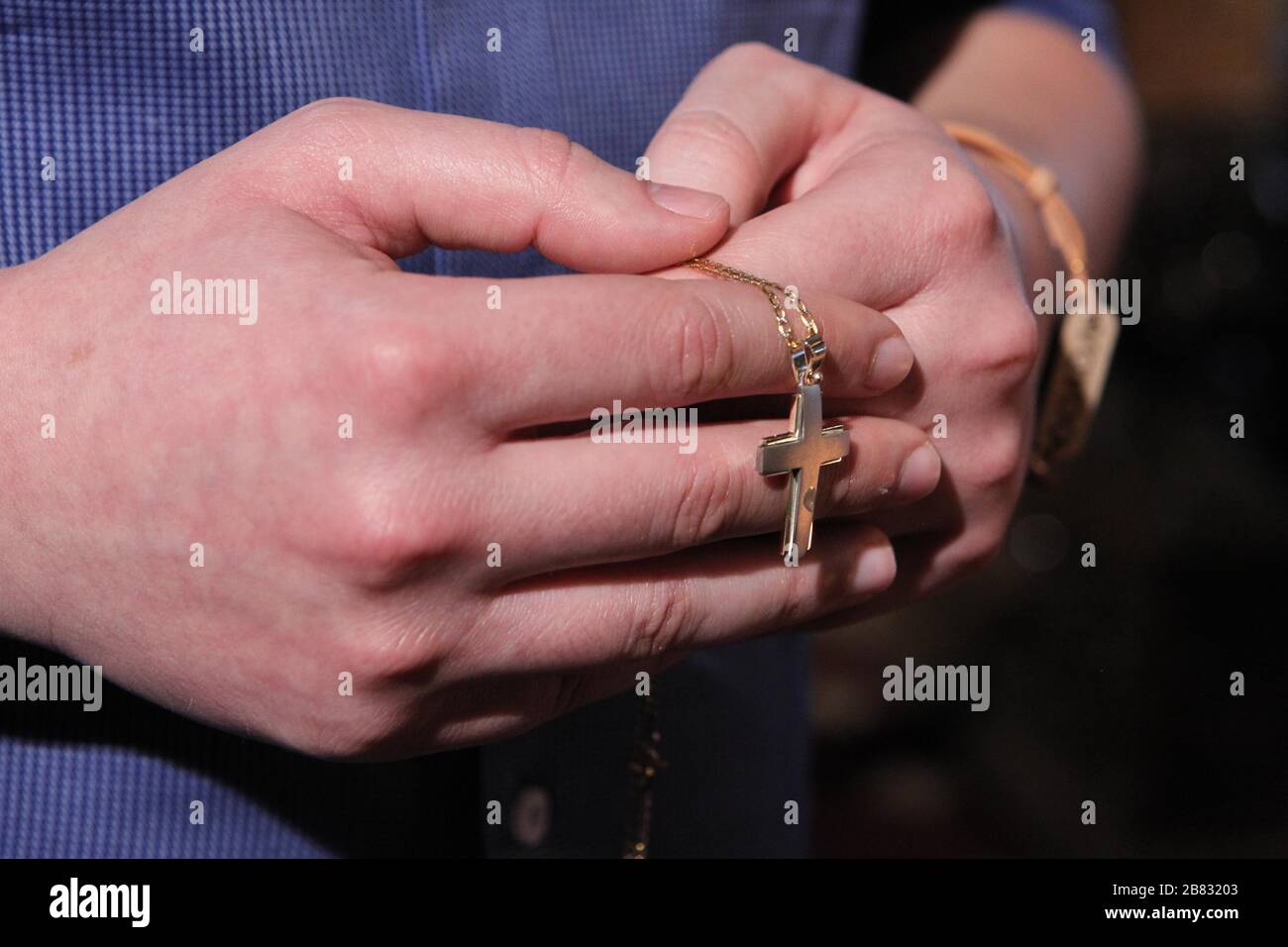 Praying hands holding rosary beads hi-res stock photography and images ...
