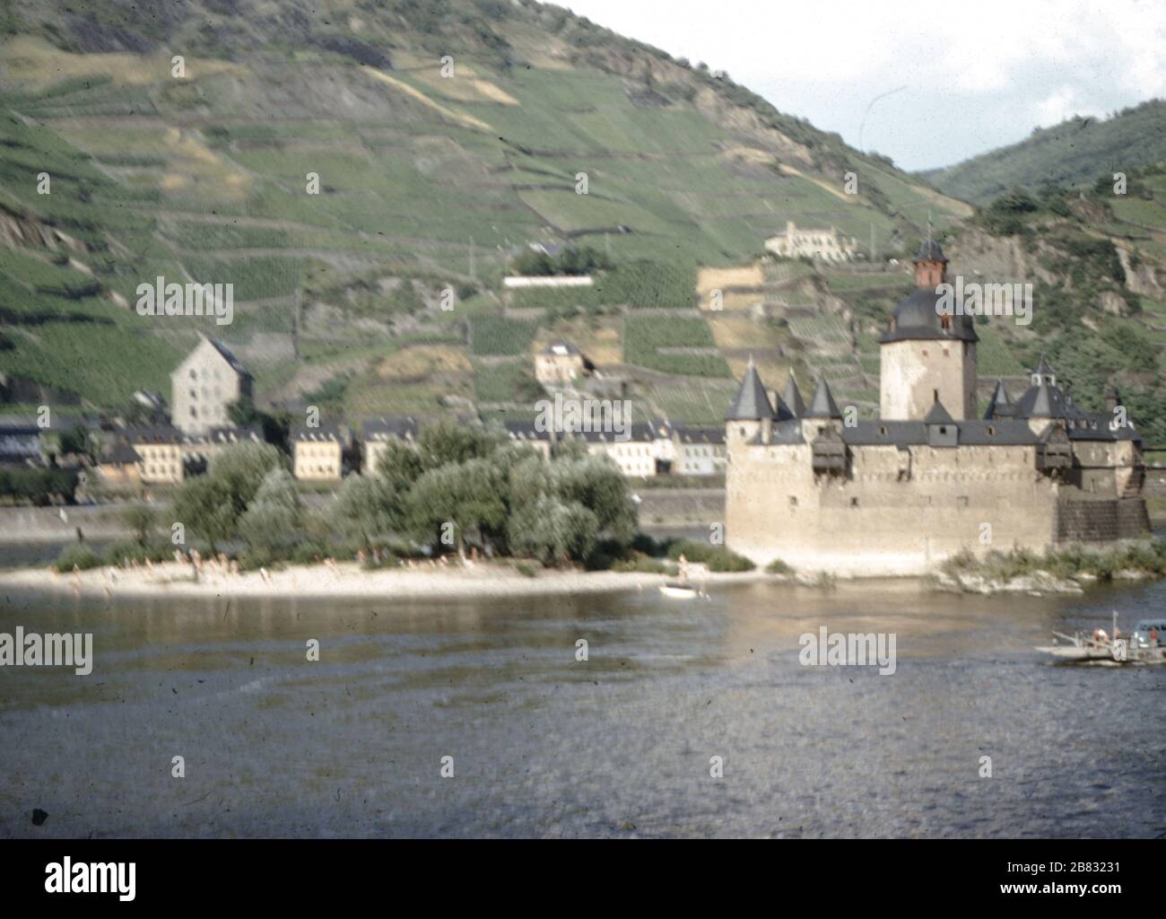 Walls and ramparts of fortification are visible beside a river, 1965 ...