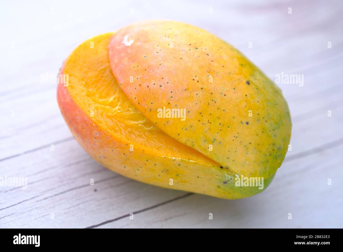 Close up of ripe mango on white background Stock Photo - Alamy