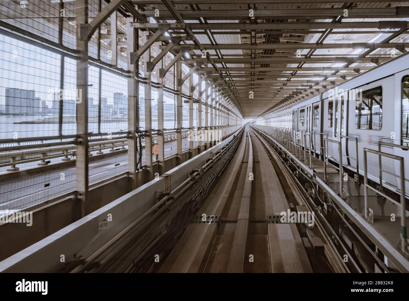 tunnel of monorail road view from front window of a moving train ...