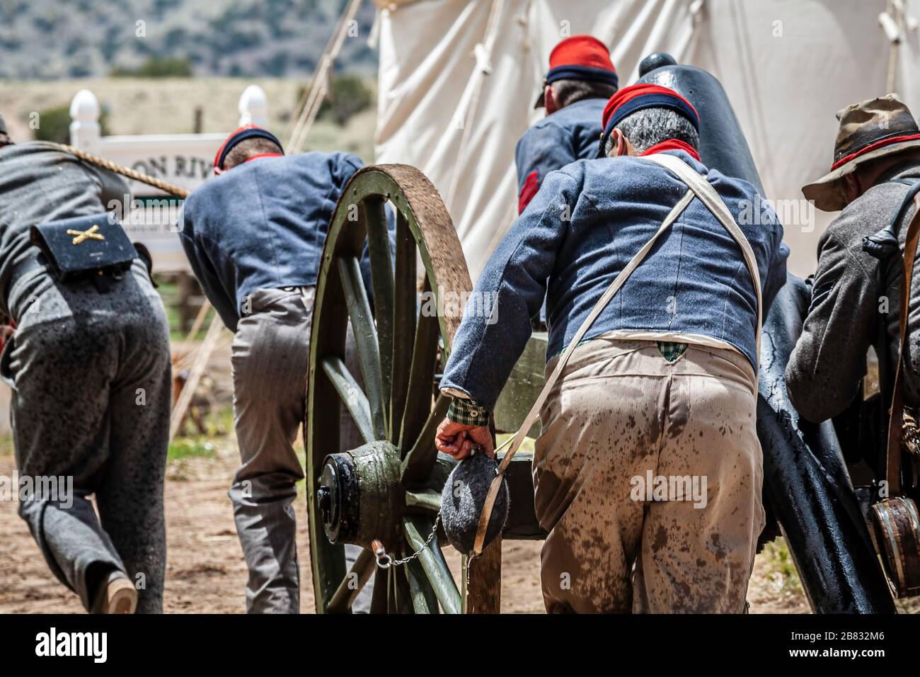 Confederate Army artillery crew pushing cannon, Civil War reenactment ...