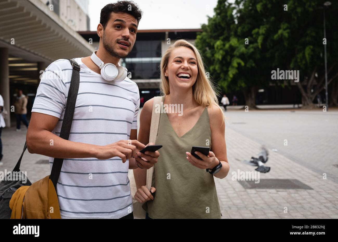 Front view of a happy Caucasian couple out and about Stock Photo - Alamy