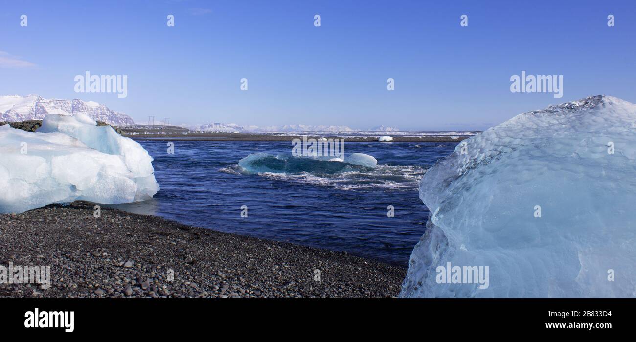 ice fields at the black pebble beach, coast of iceland Stock Photo - Alamy
