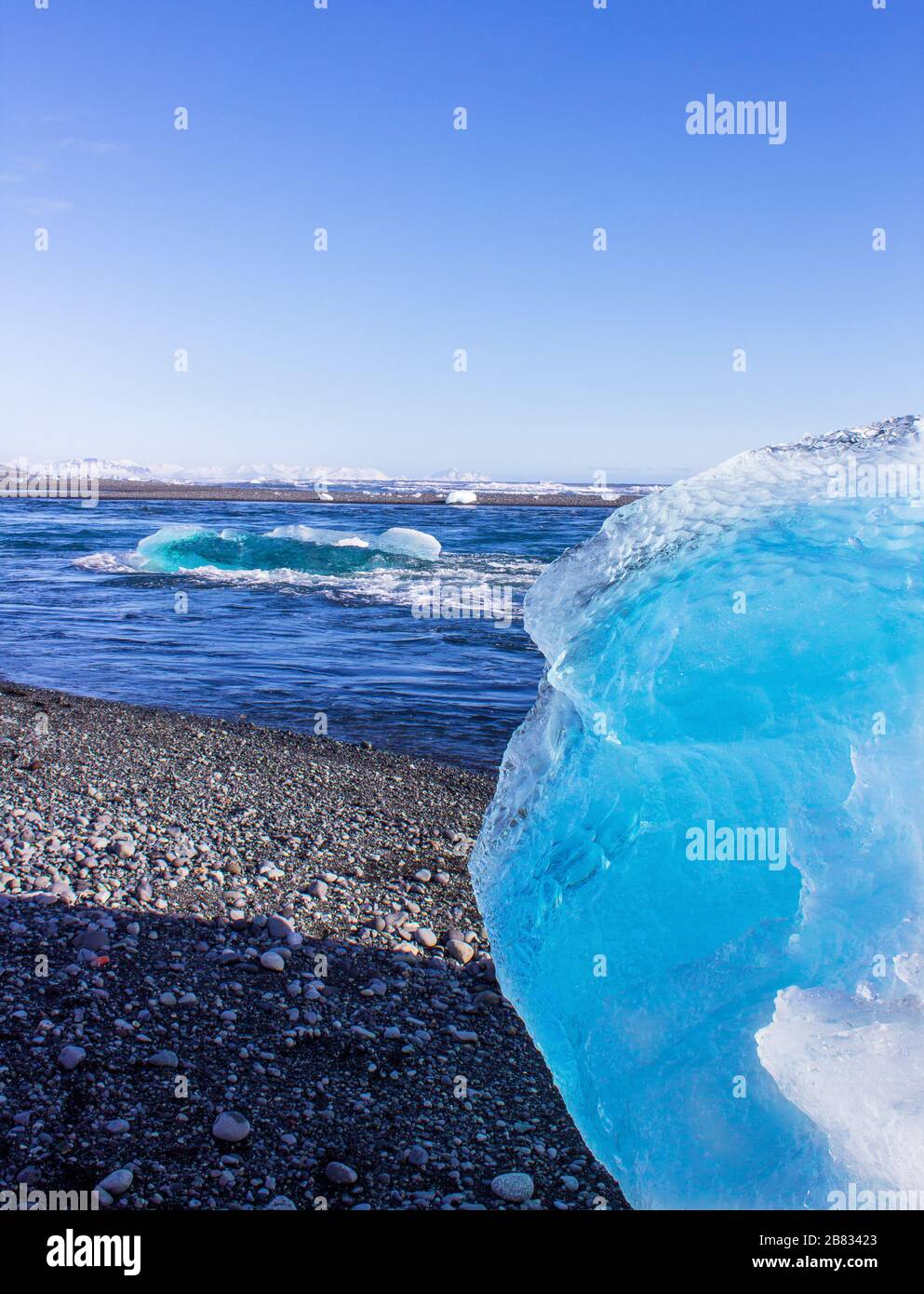 ice fields at the black pebble beach, coast of iceland Stock Photo - Alamy