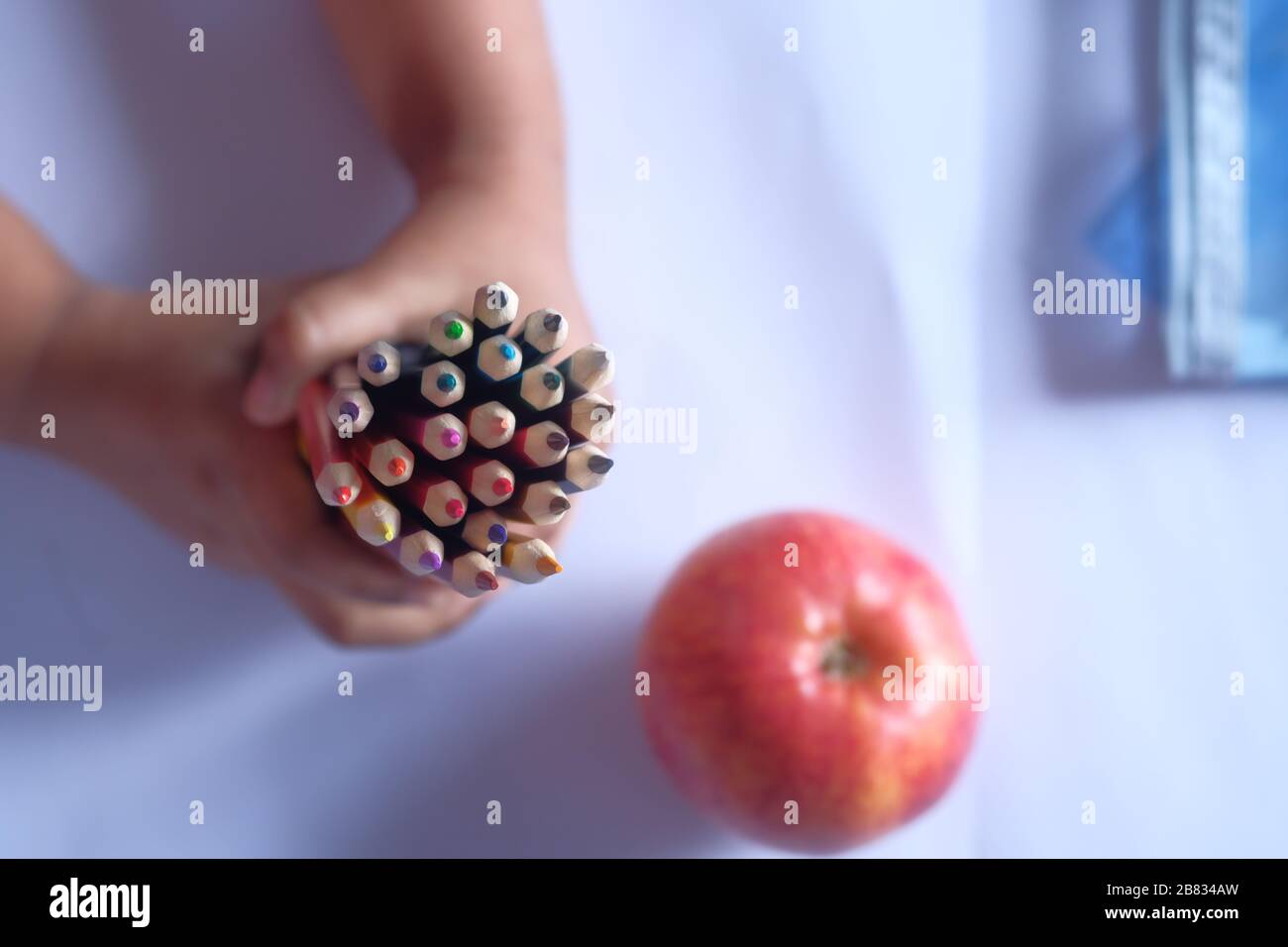 Child holding crayons hi-res stock photography and images - Alamy